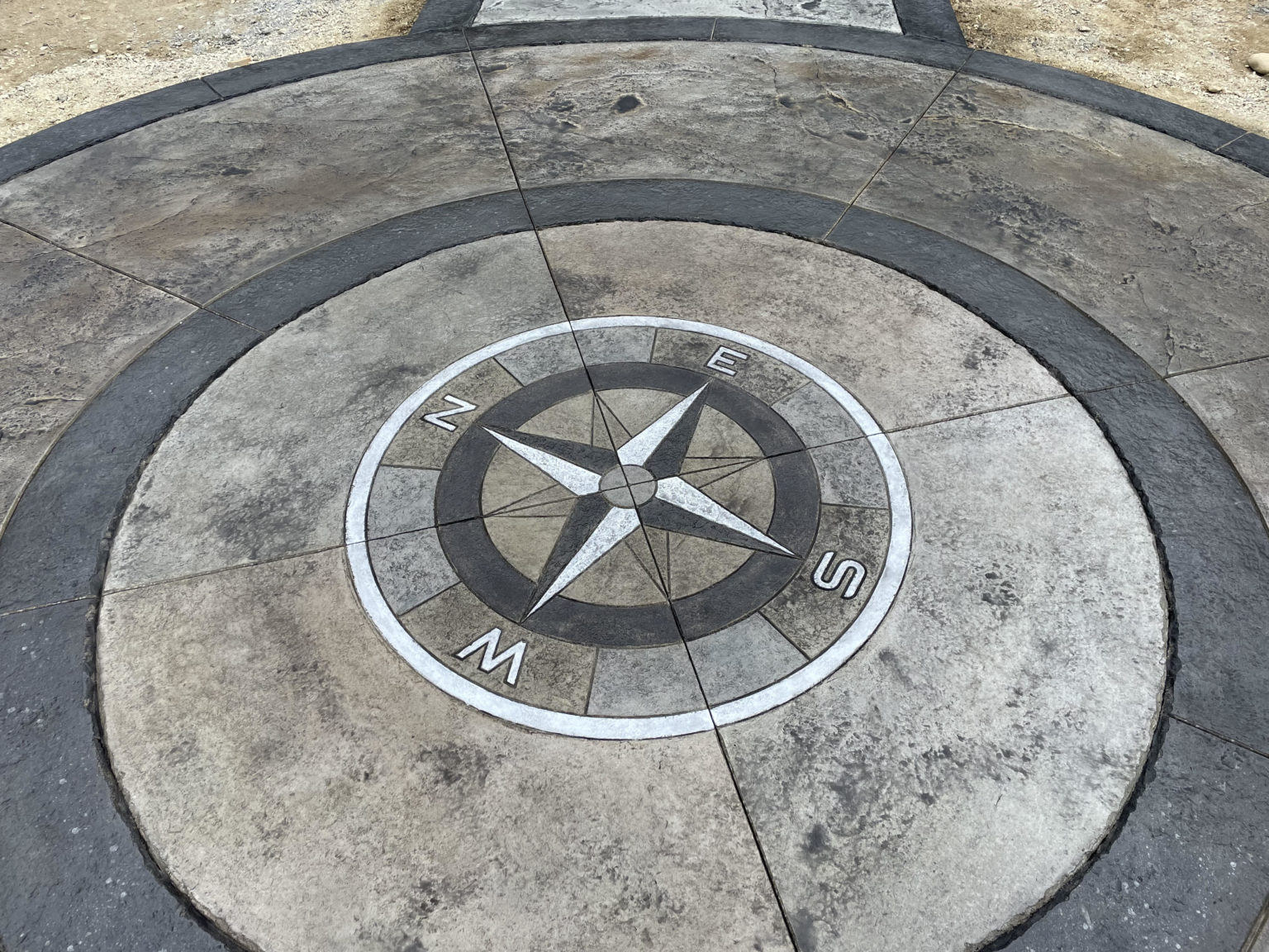 The Beauty of Stamped Concrete Medallions - Calico Construction Products